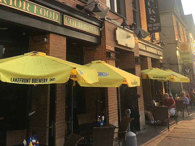 Sun-dappled sidewalk seating under Lakefront Brewery umbrellas &ndash; Milwaukee's version of al fresco dining with a side of people-watching.