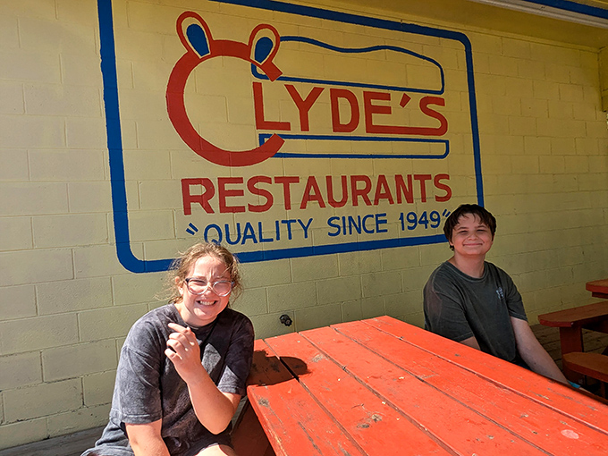Outdoor seating where memories are made. Those red picnic tables have hosted more happy meals than any fast food chain could dream of.