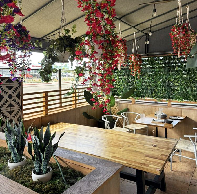 The outdoor patio brings the garden-to-table concept full circle. Cascading bougainvillea creates natural privacy screens while you savor every bite al fresco.