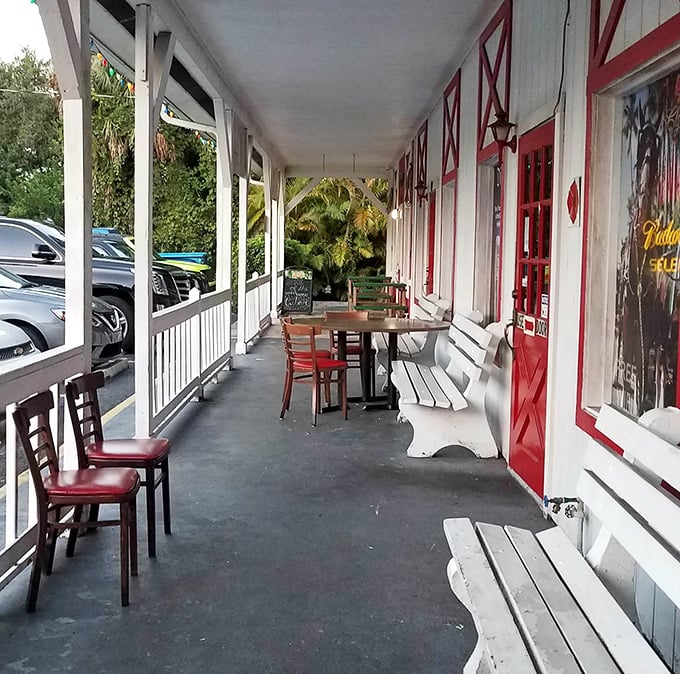 The front porch seating offers that quintessential Florida dining experience&mdash;casual conversations under ceiling fans with palm trees swaying nearby.