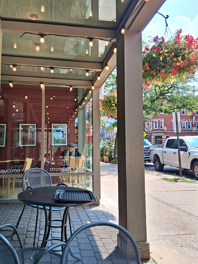 Outdoor seating adorned with hanging flower baskets offers the perfect perch for people-watching while savoring your Italian delicacies.