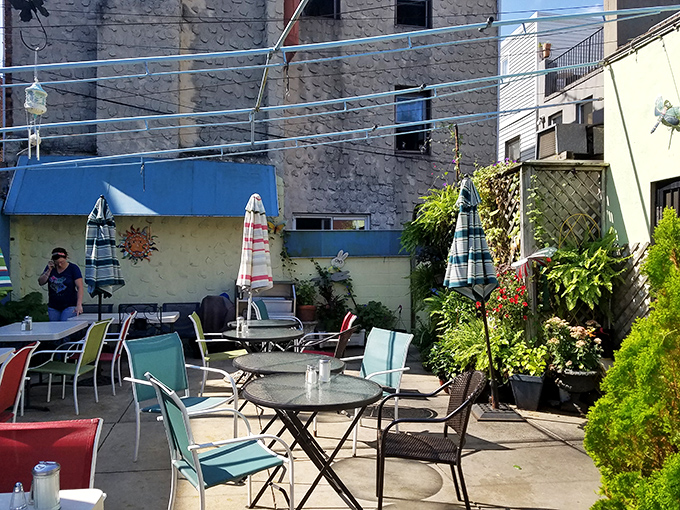 The hidden patio feels like stumbling upon a secret garden where breakfast tastes even better under the open sky.