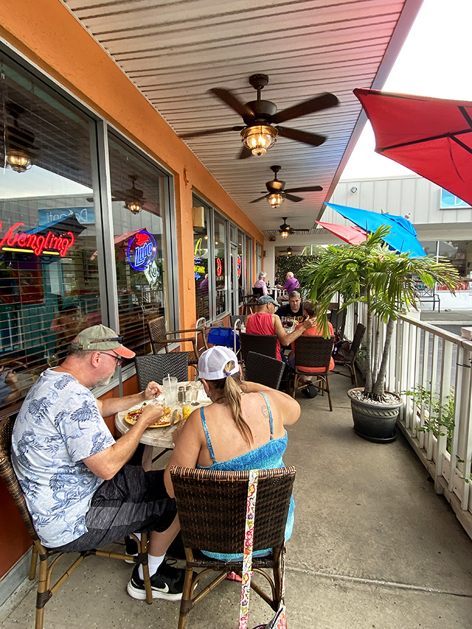The outdoor seating area where salty breezes enhance every bite, and nobody judges you for wearing flip-flops to what might be the best meal of your week.
