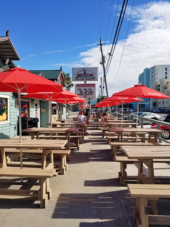 Picnic tables under Coca-Cola umbrellas&mdash;Florida's version of al fresco dining. The perfect spot to enjoy seafood while getting that vitamin D prescription filled.
