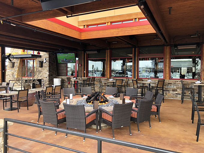 Outdoor dining elevated with fire pit centerpiece. This patio setup makes al fresco eating possible even when Virginia weather plays hard to get.