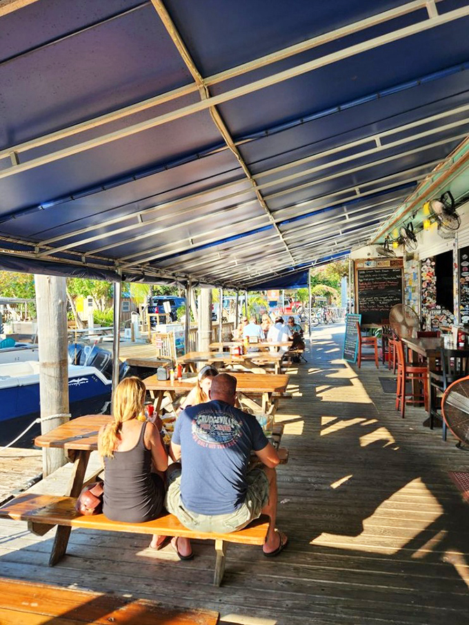 The outdoor seating area isn't designed by an architect with buzzwords—it's evolved organically, like the perfect spot to watch the world float by.