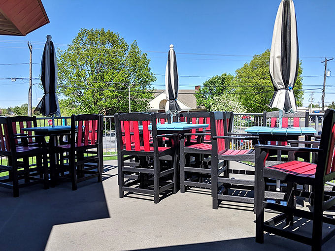 Outdoor seating where fresh air enhances every bite. Those colorful chairs invite you to linger just a little longer.
