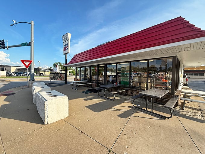 Outdoor seating where summer memories are made between bites, under the watchful eye of that classic Stoplight sign.