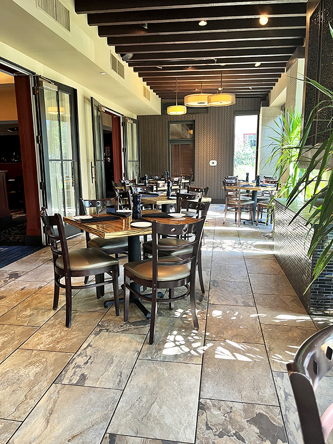 The outdoor seating area bathes in natural light, offering a more casual vibe without sacrificing an ounce of Blue Grillhouse elegance.