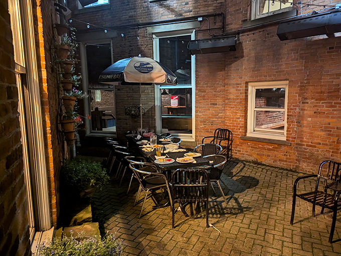 The brick-walled courtyard where fresh air enhances flavor. Outdoor dining that feels like you've discovered Toledo's best-kept secret.