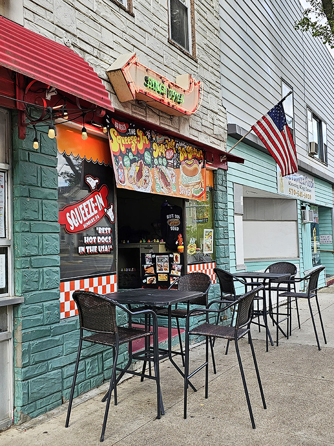 Outdoor seating for those who prefer their hot dog experience with a side of fresh air and people-watching. Urban dining at its most honest.