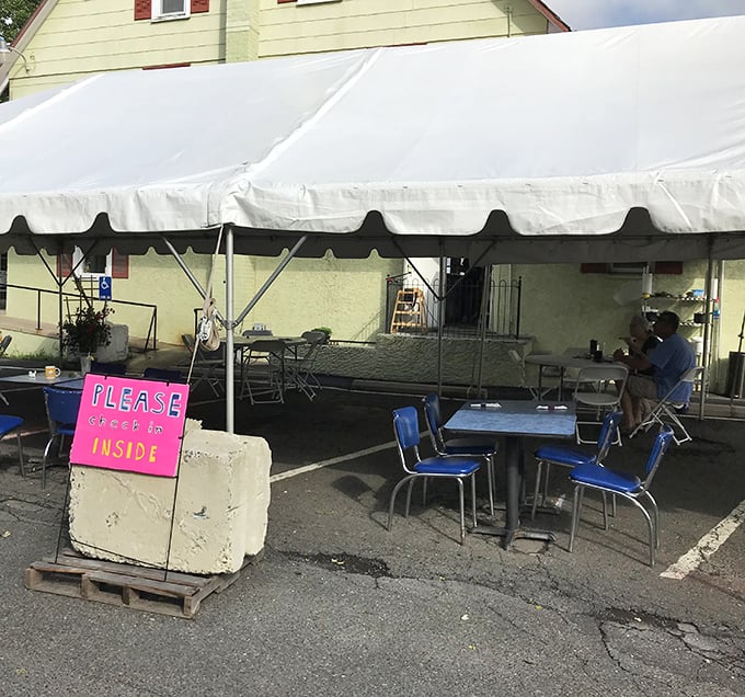 Pandemic-era outdoor seating proves good food finds a way. Even under a tent, those blue chairs promise the same Cross Keys magic.