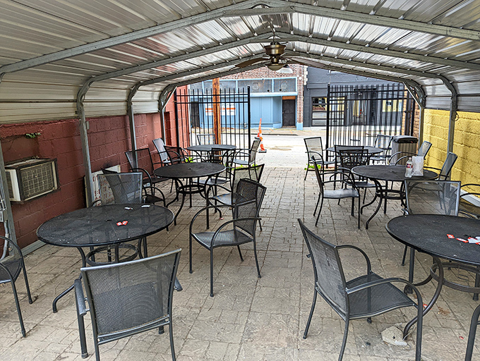 Al fresco dining, Kitty's style. These simple metal tables have hosted countless conversations over exceptional sandwiches through the seasons.
