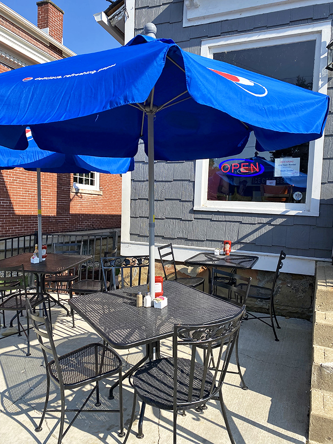 When Ohio weather cooperates, the outdoor seating under Pepsi umbrellas becomes prime real estate for people-watching and french fry dunking.