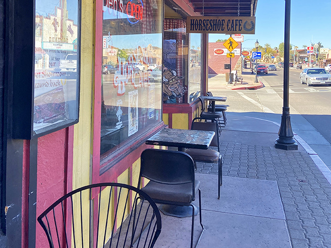 Sidewalk seating offers front-row tickets to Wickenburg's daily parade of cowboys, tourists, and locals going about their desert town business.