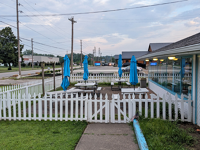 Outdoor seating where the fresh air somehow makes the food taste even better. Those blue umbrellas have witnessed countless "I'm too full to move" moments.