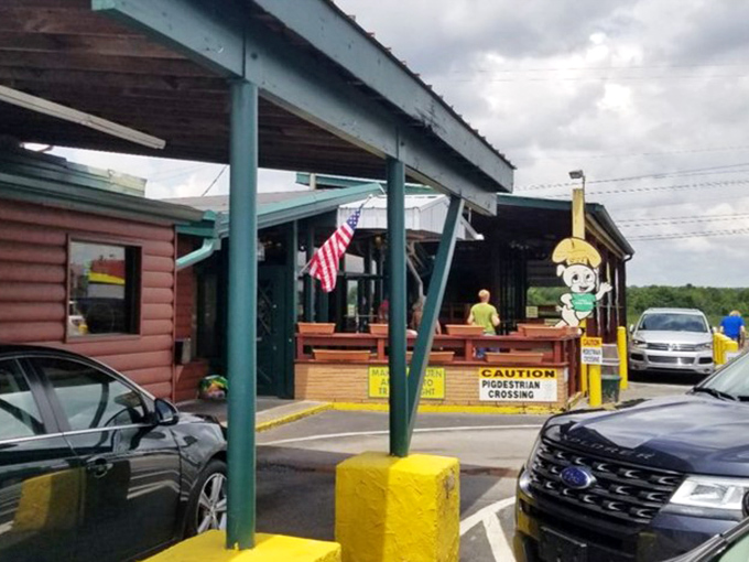 Even from the parking lot, those cartoon pigs beckon with barbecue promises. The American flag adds that perfect touch of local pride.