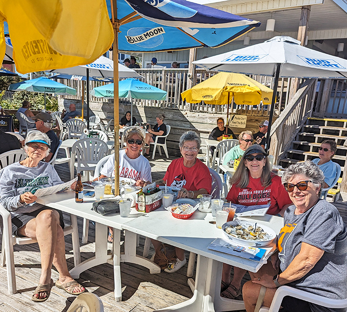 Umbrellas providing shade for sun-kissed diners. These folks aren't just eating lunch&mdash;they're collecting stories to make their northern friends jealous.