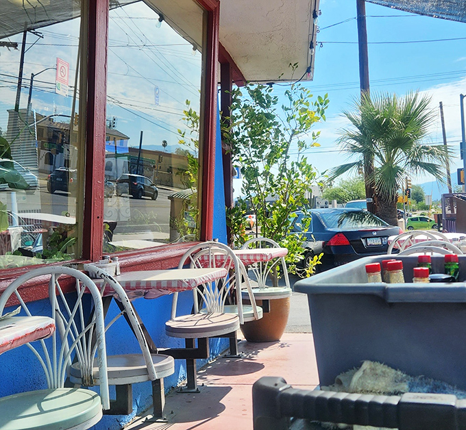Outdoor seating with a view of Tucson life passing by &ndash; palm trees included at no extra charge.