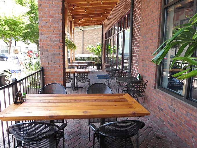 Outdoor dining that feels like a secret garden. These brick-framed tables offer fresh air with a side of people-watching.