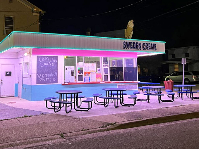 As night falls, Sweden Creme's neon glow transforms into a pink-and-blue beacon, drawing moths and ice cream lovers with equal magnetic force.