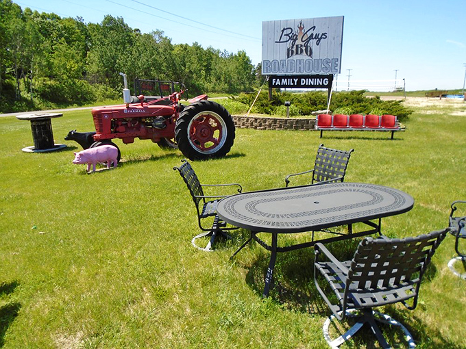 The outdoor setting combines farm charm with dining practicality. That pink pig statue knows what happens inside, yet still smiles&mdash;now that's confidence.