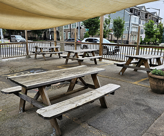 Outdoor picnic tables under canvas shade offer al fresco dining with a side of people-watching and Georgia sunshine.