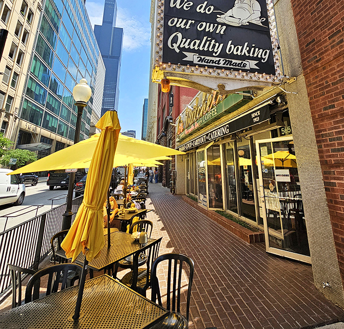 Outdoor seating at Lou Mitchell's offers a front-row view of Chicago's urban rhythm, with the Willis Tower standing guard over your breakfast. 