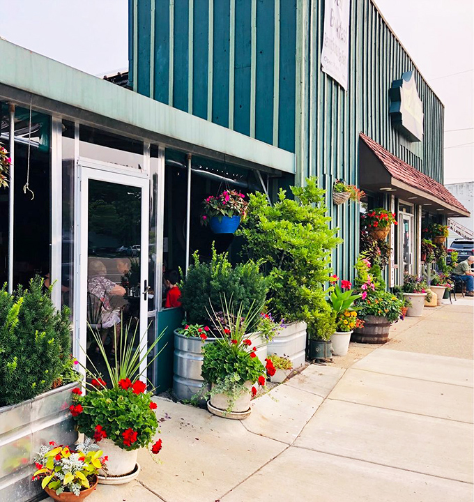 The exterior's lush container gardens create a welcoming approach that says, "Slow down, the food is worth the wait."