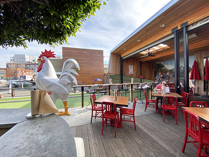 That iconic chicken statue watches over diners like a feathered guardian angel, silently judging those who don't clean their plates.