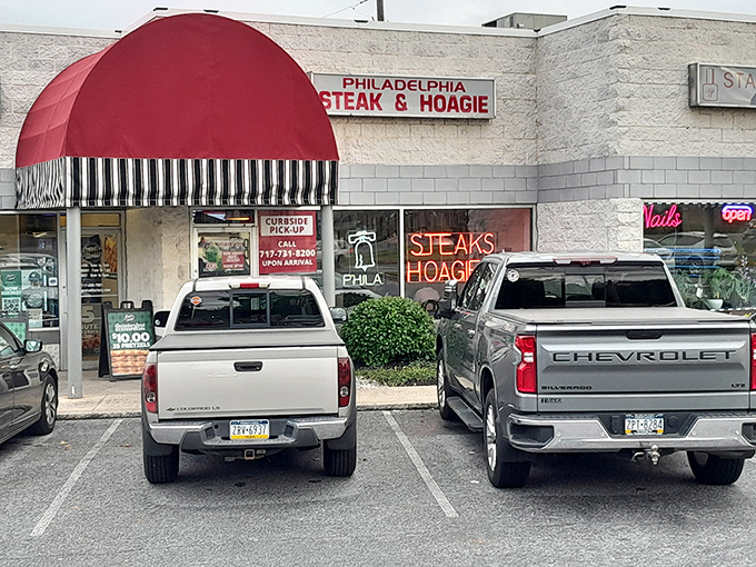 The parking lot view&mdash;where anticipation builds as you pull in, knowing sandwich nirvana awaits just beyond that distinctive red awning.