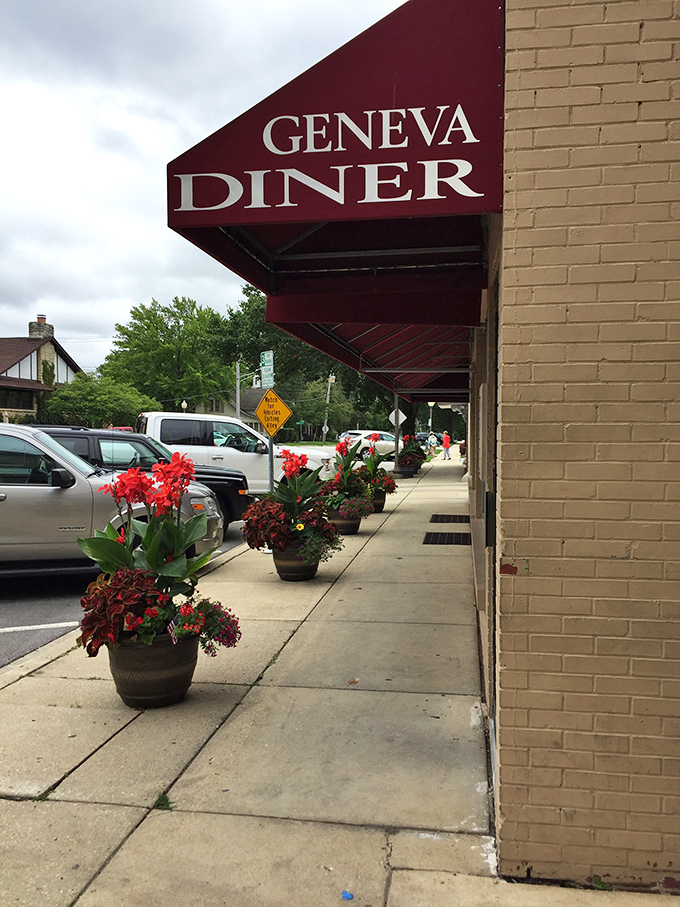 Even the sidewalk outside Geneva Diner looks welcoming, with flower pots standing at attention like cheerful sentries guarding the temple of breakfast.