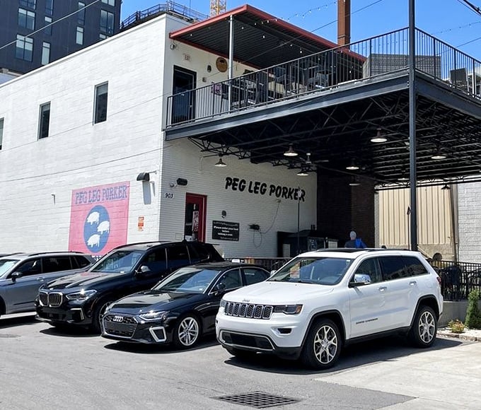 The parking lot isn't just filled with cars; it's populated with vehicles whose owners are about to have a significantly better day than everyone else.