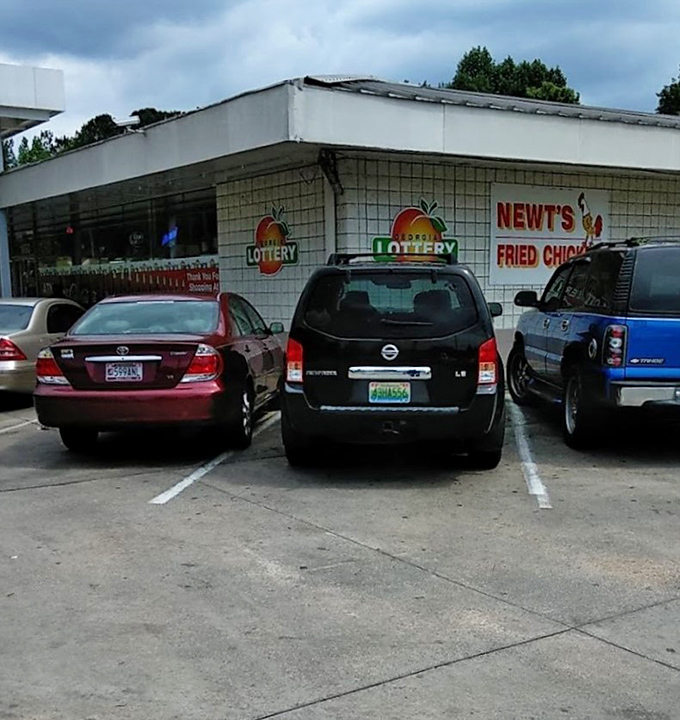 The parking lot tells the story - cars from all walks of life gathered for the great equalizer: exceptional fried chicken.