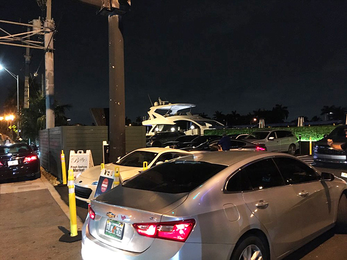 Even the parking lot hints at the experience within&mdash;boats visible beyond cars, promising a meal where land meets sea in delicious harmony.