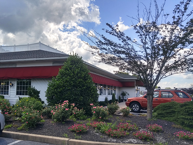 Gardens surround the restaurant like a colorful welcome committee, setting the tone for the fresh flavors waiting inside. 