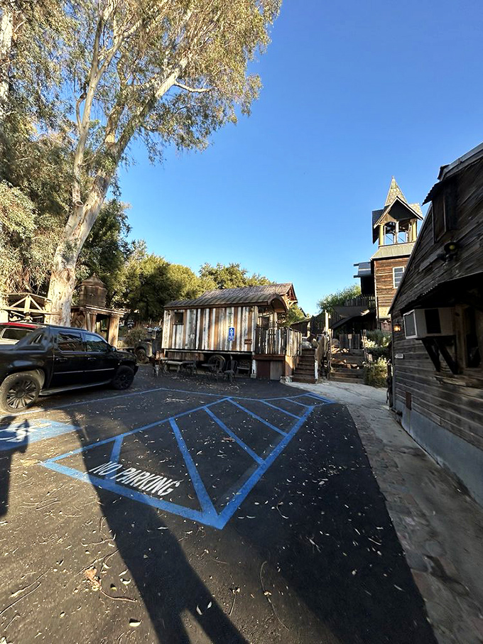 Even the parking area maintains the frontier aesthetic. That "NO PARKING" space might be the only rule you'll encounter in this refreshingly regulation-free zone.