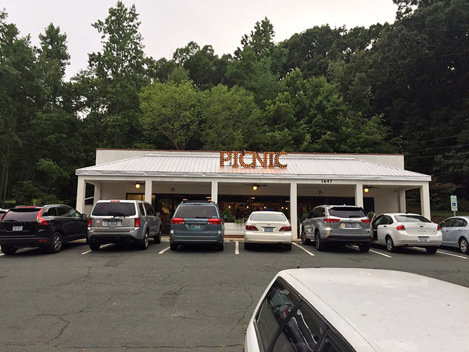 The parking lot tells the story - locals and travelers alike making the pilgrimage to this temple of smoke. Your car knows the way home, but it doesn't want to leave.