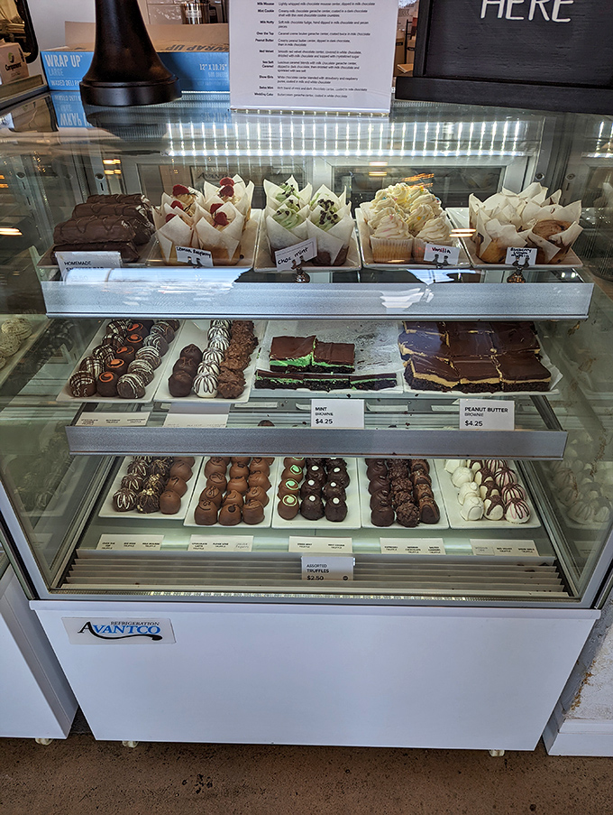 A display case that tests willpower like nothing else. Cupcakes, chocolates, and pastries arranged with such care they're practically begging to join you for dessert.