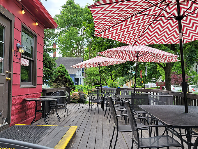 Red and white umbrellas create a cheerful oasis on the deck. Summer dining perfection just steps from the Monon Trail.