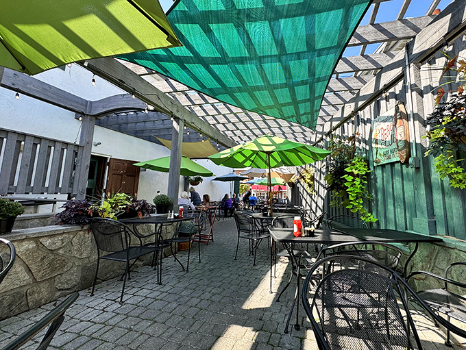 The covered patio creates an outdoor oasis where dappled sunlight filters through, making even water look like it was poured by a professional photographer.