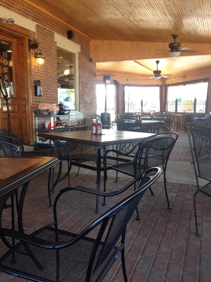 The patio seating area&mdash;where brick floors and ceiling fans create the perfect setting for summer BBQ sessions and people-watching with a side of brisket.