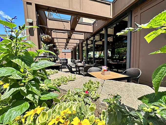 Outdoor seating surrounded by lush greenery creates an urban oasis. Nature and nurture combine to make every al fresco bite taste even better.