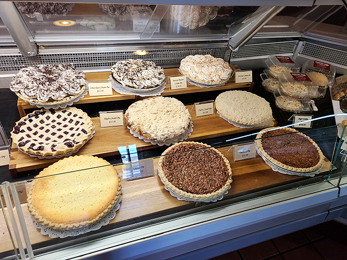 A pie display that makes choosing just one slice mathematically impossible. The only reasonable solution is to order multiple varieties.