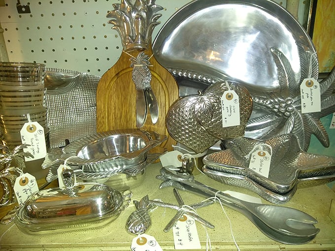 Pineapple-shaped serving pieces and silver platters waiting for their second act. These aren't just utensils&mdash;they're conversation pieces with handles.