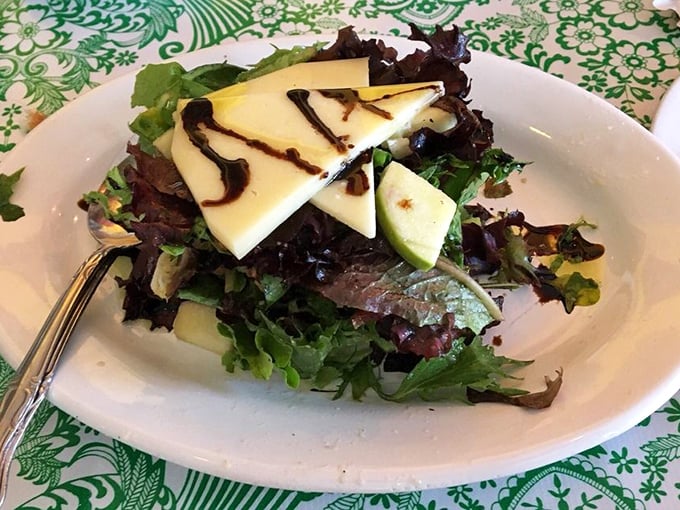 Fresh greens topped with cheese that proves even the healthiest choices can be absolutely indulgent and satisfying. 