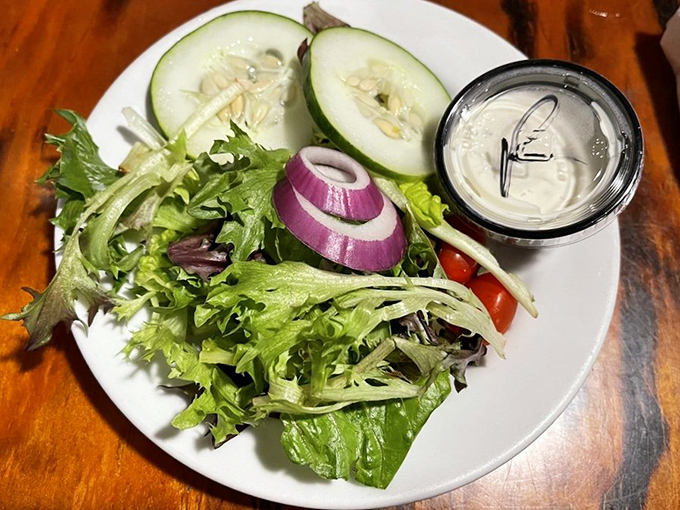 A side salad that doesn't feel like punishment. Fresh greens, vibrant vegetables, and a reminder that balance makes indulgence possible.
