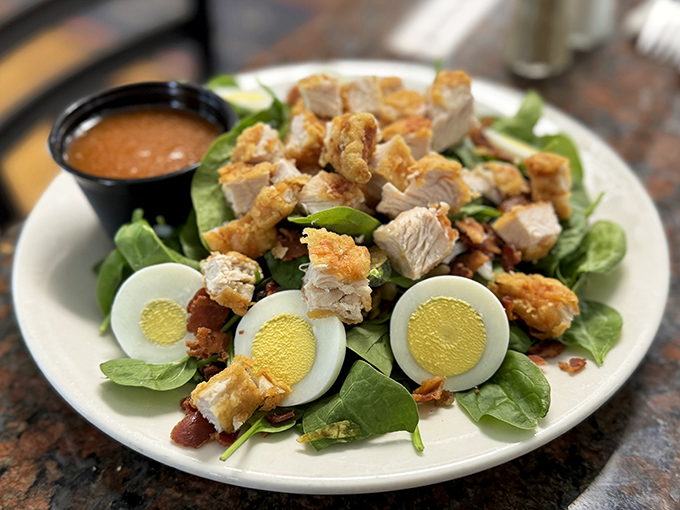 A spinach salad that doesn't feel like punishment. With Lettie's chicken, hard-boiled eggs, and house dressing, it's the rare salad that satisfies like comfort food.
