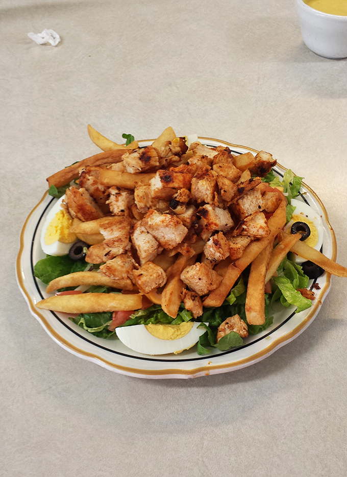 This isn't just a salad&mdash;it's a protein-packed rebellion against diner stereotypes, proving greens can coexist peacefully with french fries in perfect harmony. 