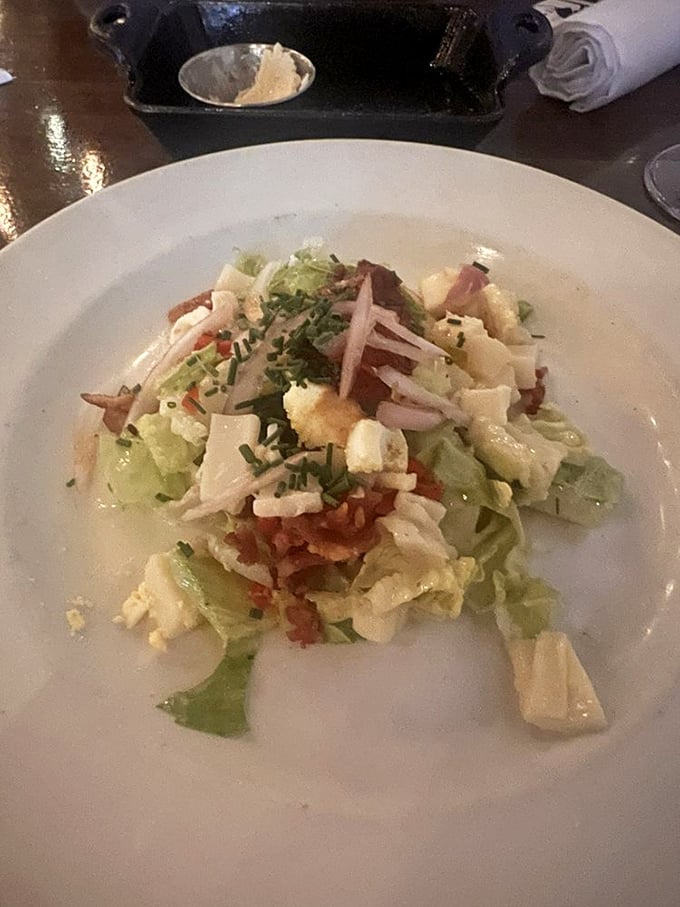 A salad that earned its place at a steakhouse. Crisp lettuce, bacon, and blue cheese create the perfect palate refresher between bites of beef.